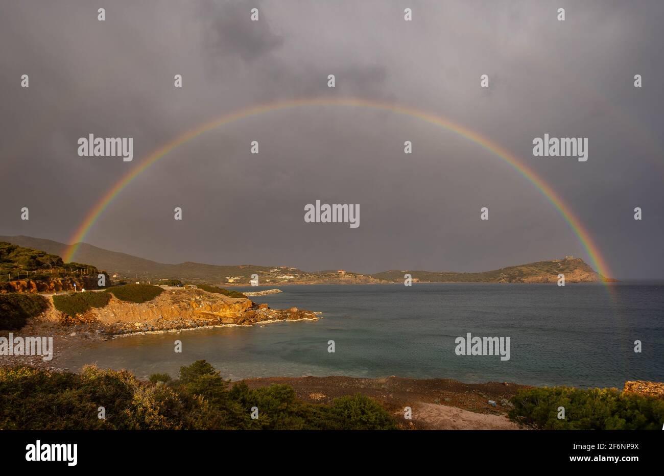 Rainbow over Poseidon temple at Sounio,Greece Stock Photo - Alamy