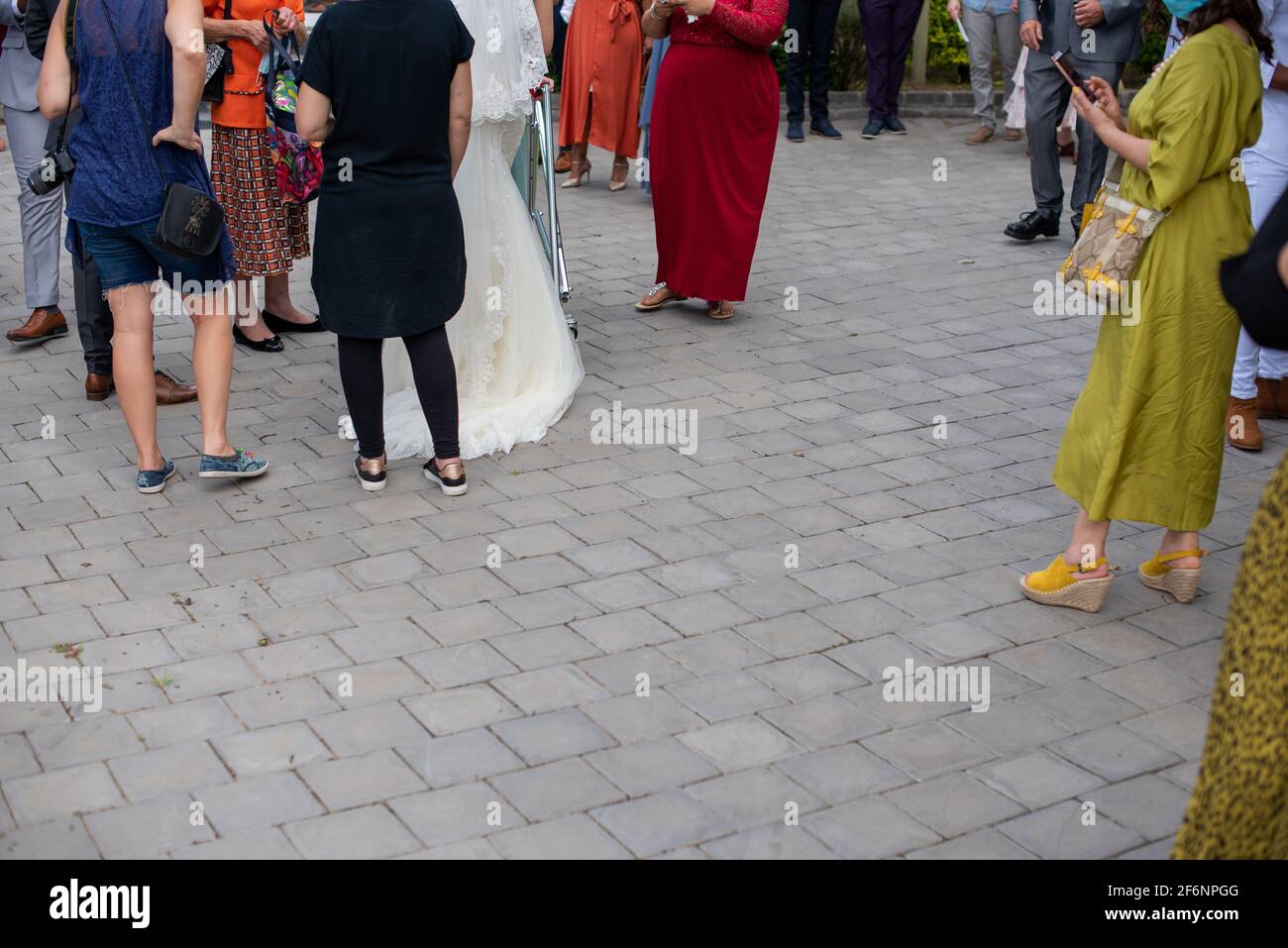 Group of people with colorful clothing at event Stock Photo - Alamy