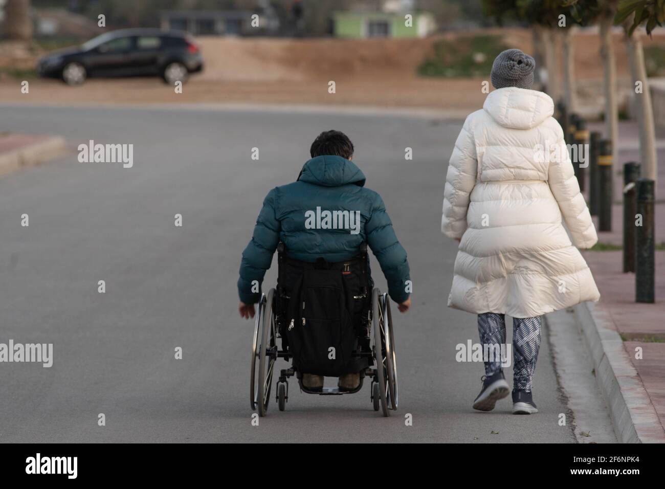 A handicapped person and its companion Stock Photo - Alamy
