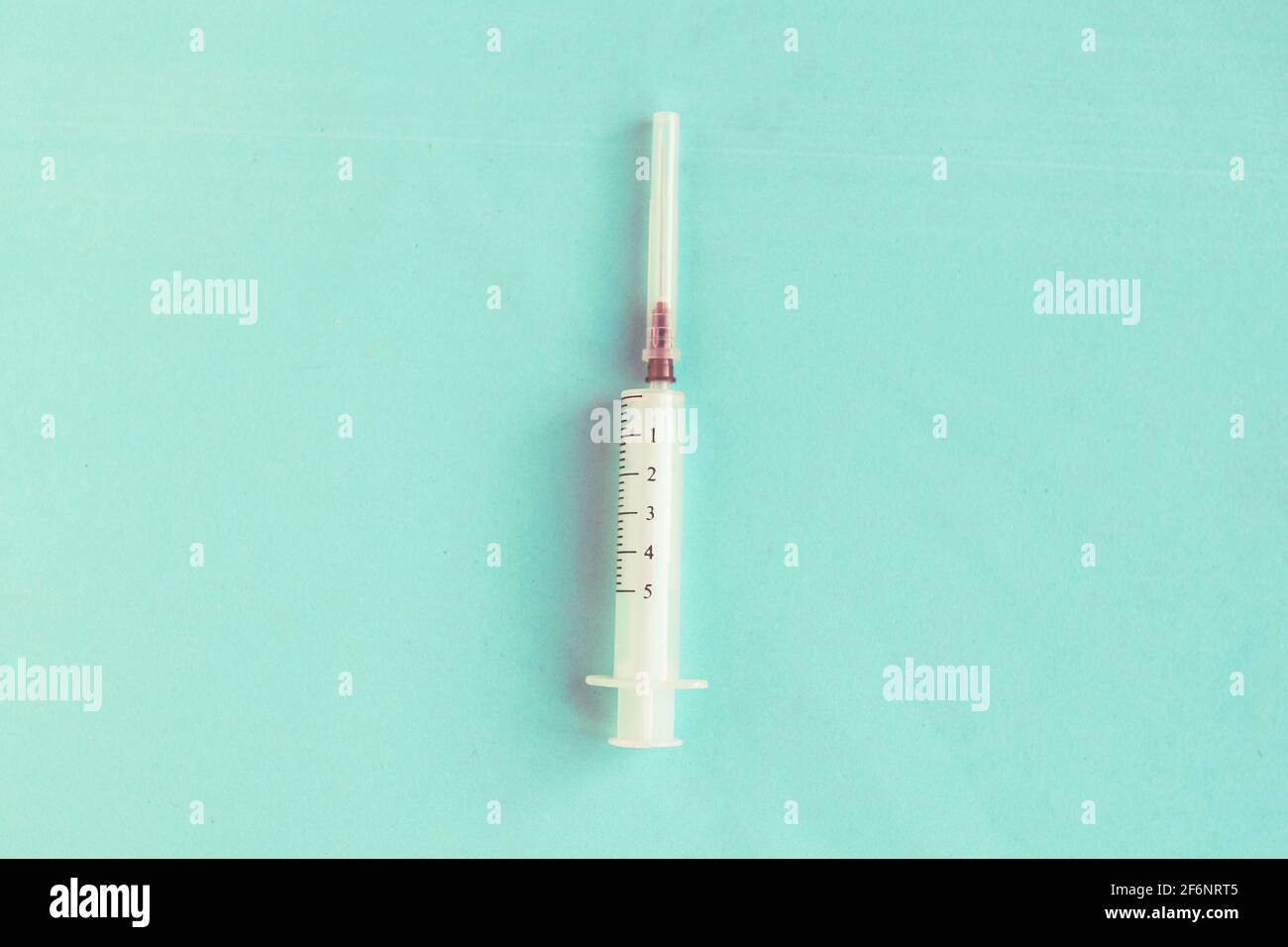 Medical syringe on pastel blue background. Top view, minimal Stock ...