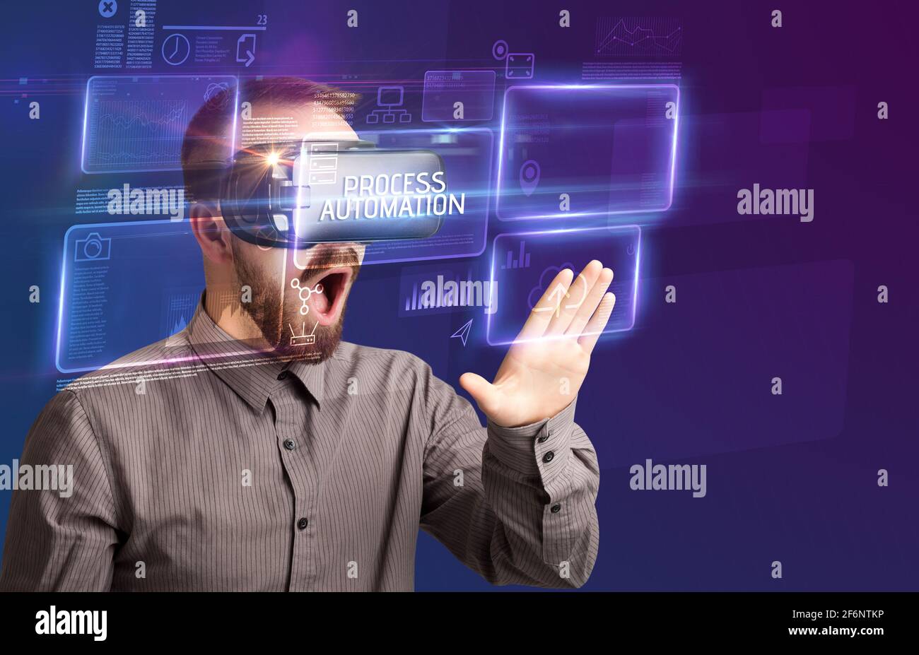 Businessman looking through Virtual Reality glasses, tech concept Stock ...