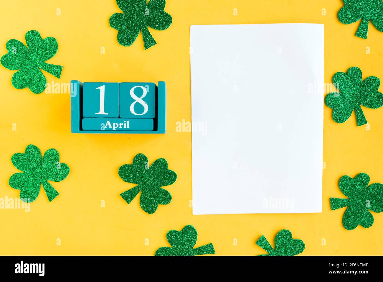 April 18. Blue cube calendar with month and date and white mockup blank ...