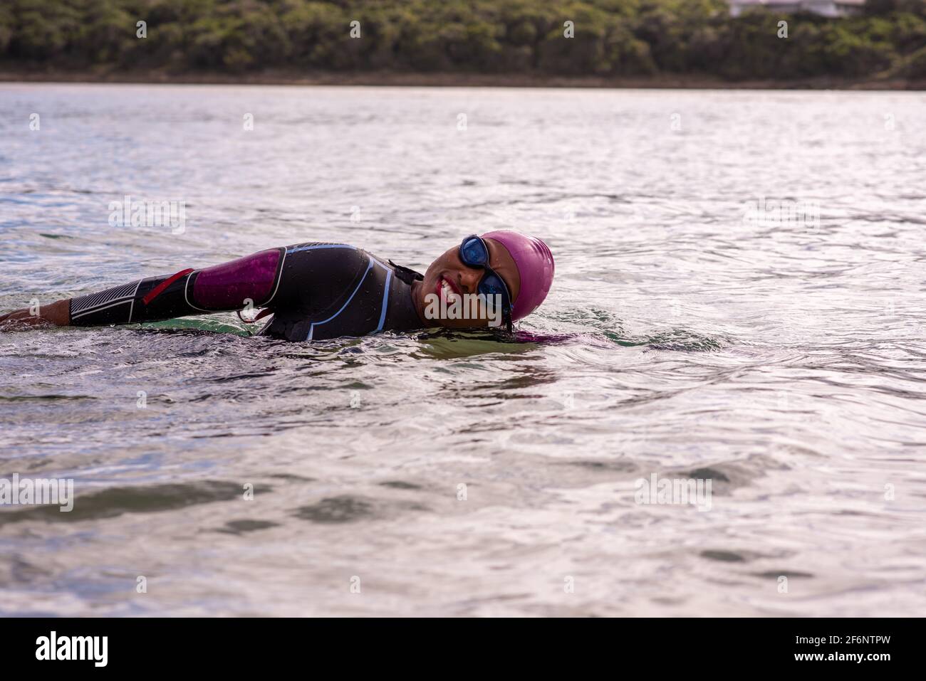 Single woman swimming in river alone Stock Photo - Alamy