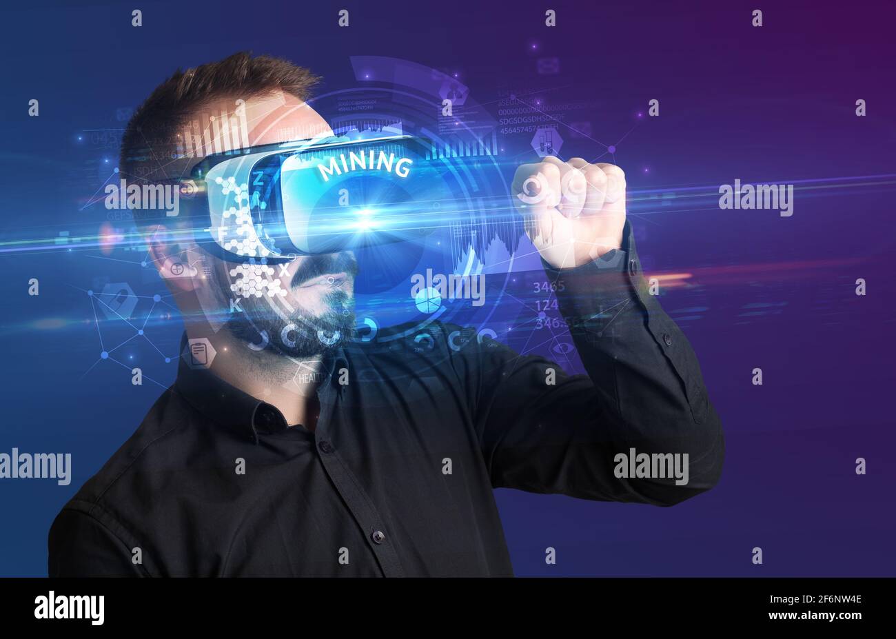 Businessman looking through VR glasses Stock Photo - Alamy