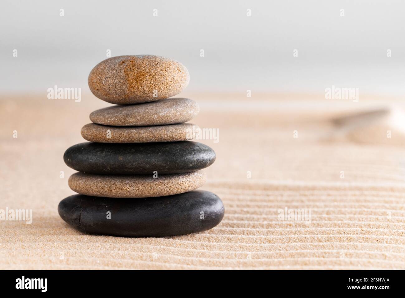 Japanese zen garden with stone in raked sand Stock Photo - Alamy