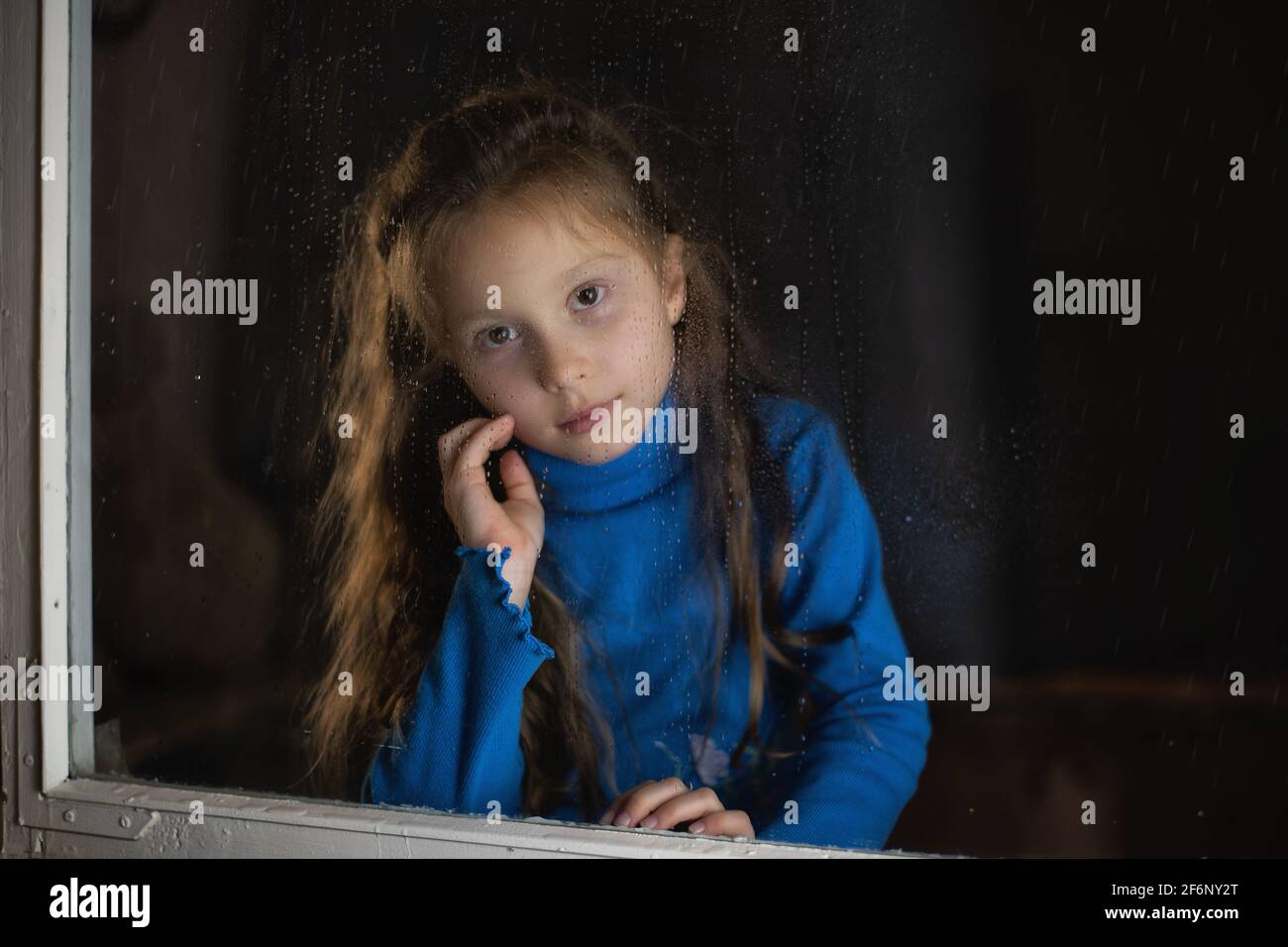 Sad girl child behind hi-res stock photography and images - Alamy