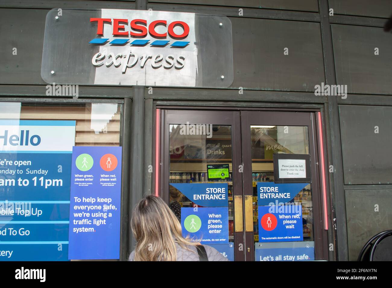 WESTMINSTER, LONDON, ENGLAND- 31 March 2021: Tesco with traffic light ...