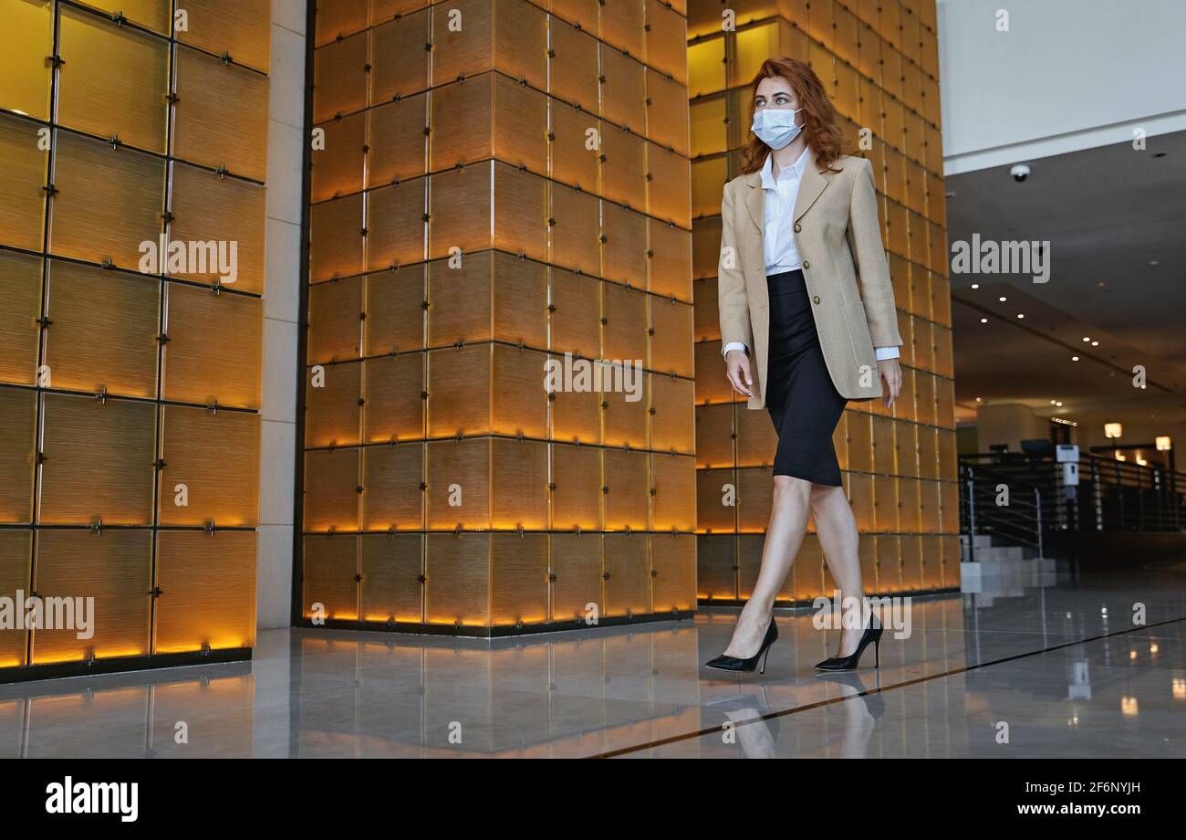 Woman walking office reception hi-res stock photography and images - Alamy