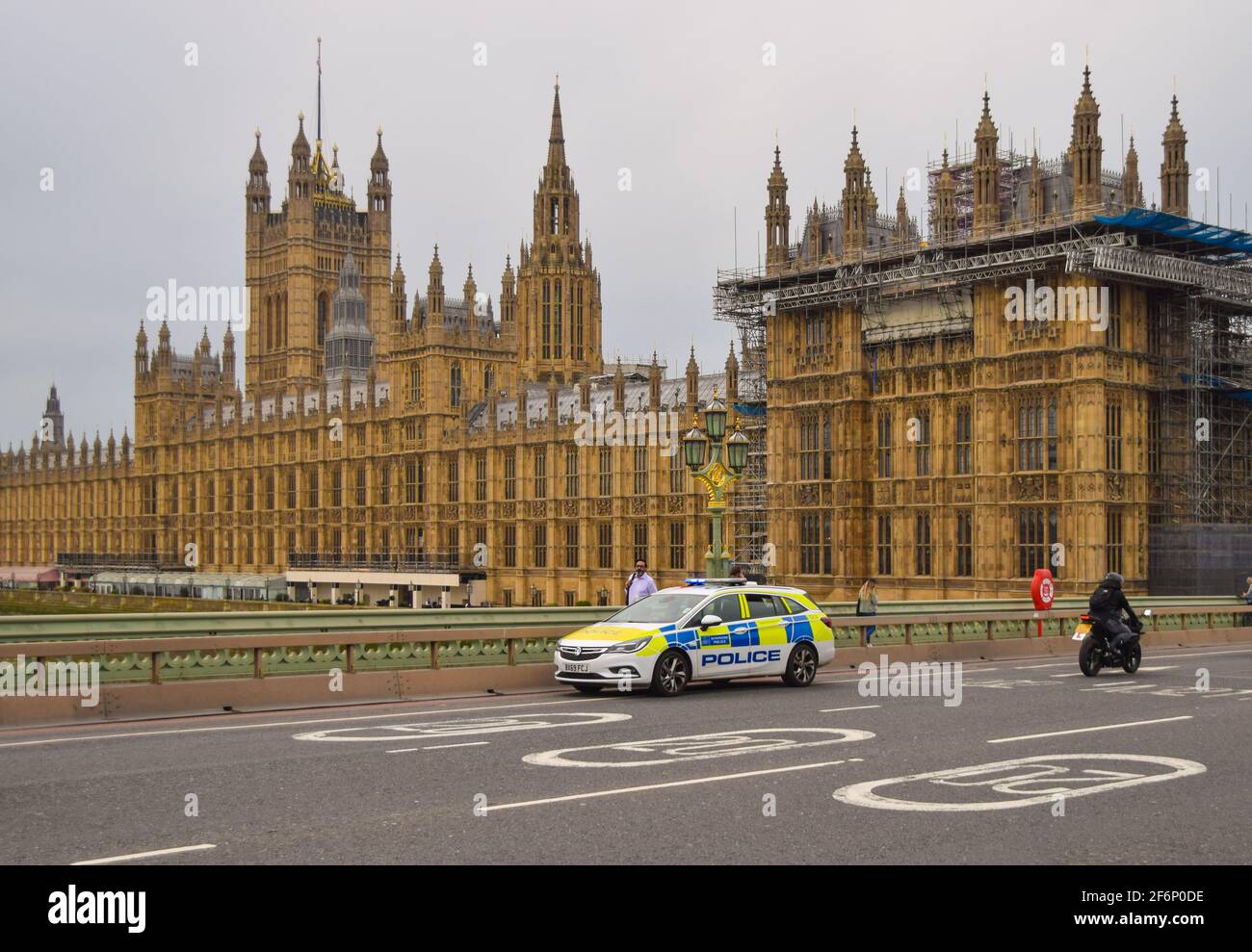 A police vehicle on Westminster Bridge next to Houses of Parliament ...