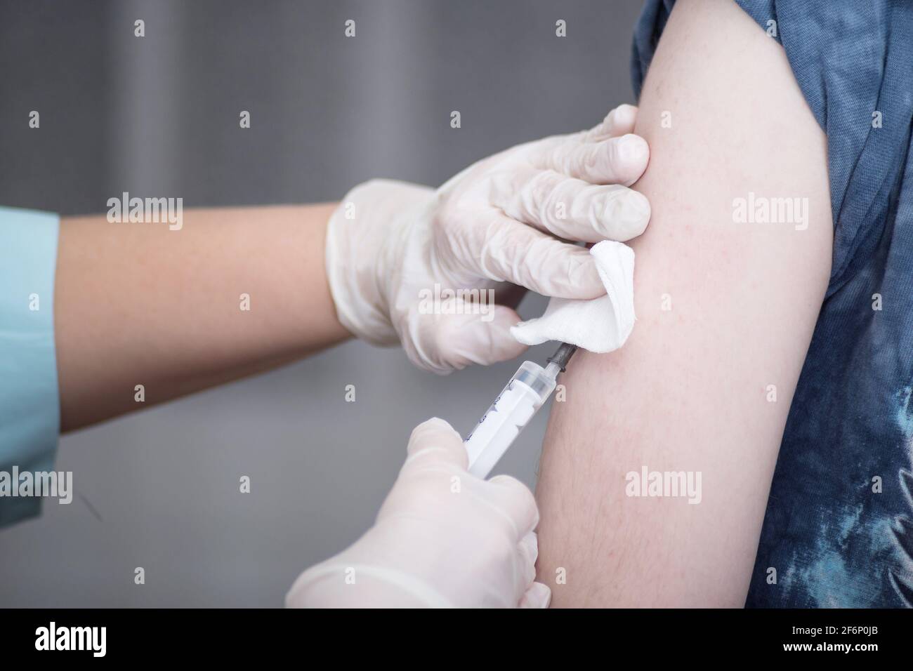 Close-up hands,nurses are vaccinations to patients using the syringe ...