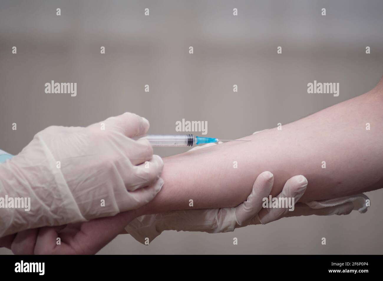 Close-up hands,nurses are vaccinations to patients using the syringe ...