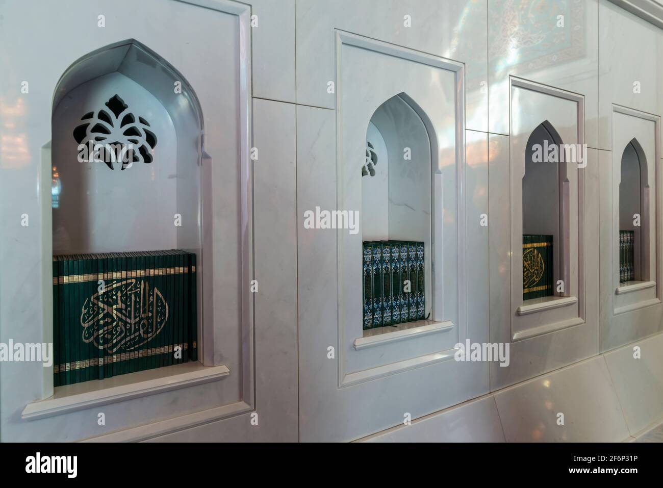 Quran books displayed in a niche in the Sultan Qaboos Grand Mosque ...
