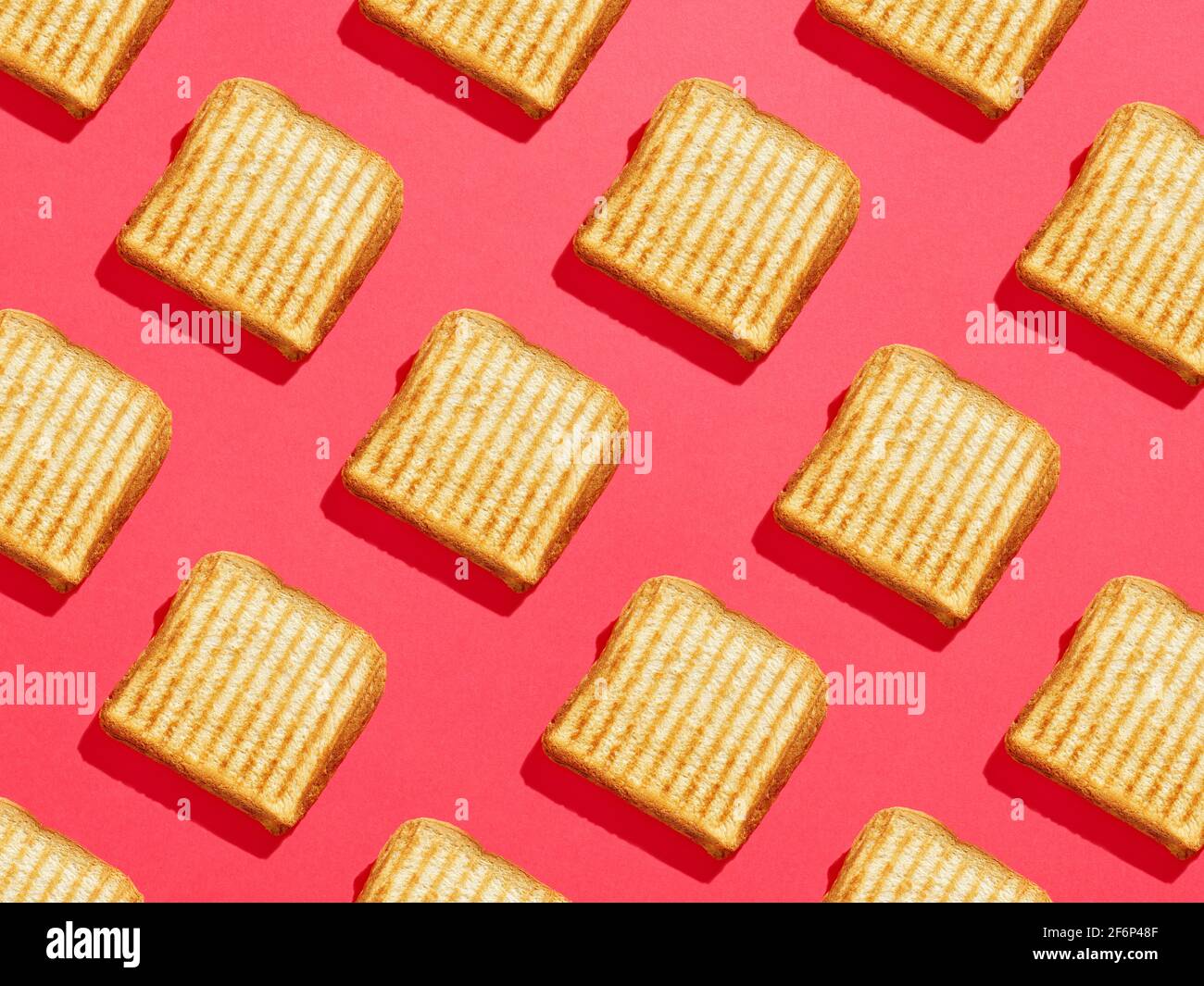 Colorful toasted sandwich pattern on pink background, top view, hard ...