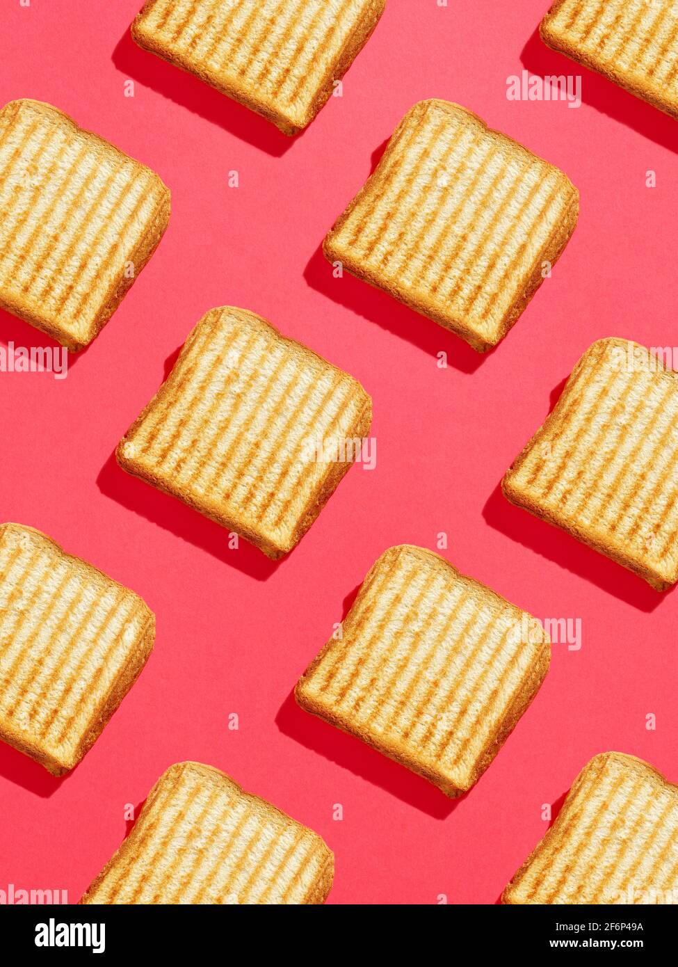 Vertical colorful toasted sandwich pattern on pink background, top view ...