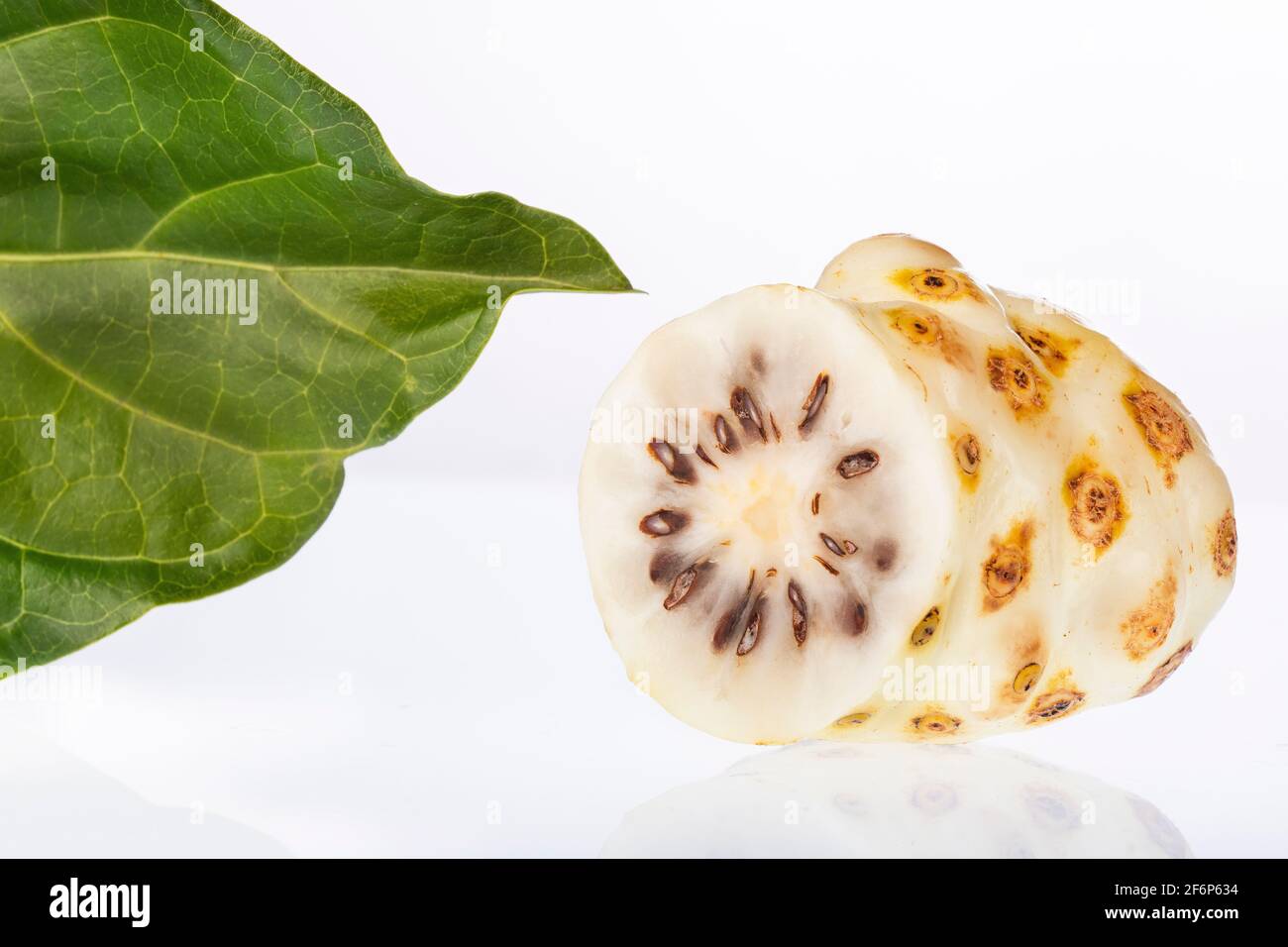 Morinda citrifolia ripe noni fruit on white background Stock Photo - Alamy