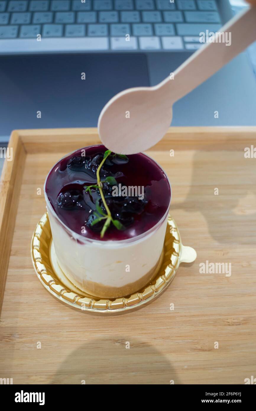Spoon on a piece of chesse cake, stock photo Stock Photo - Alamy