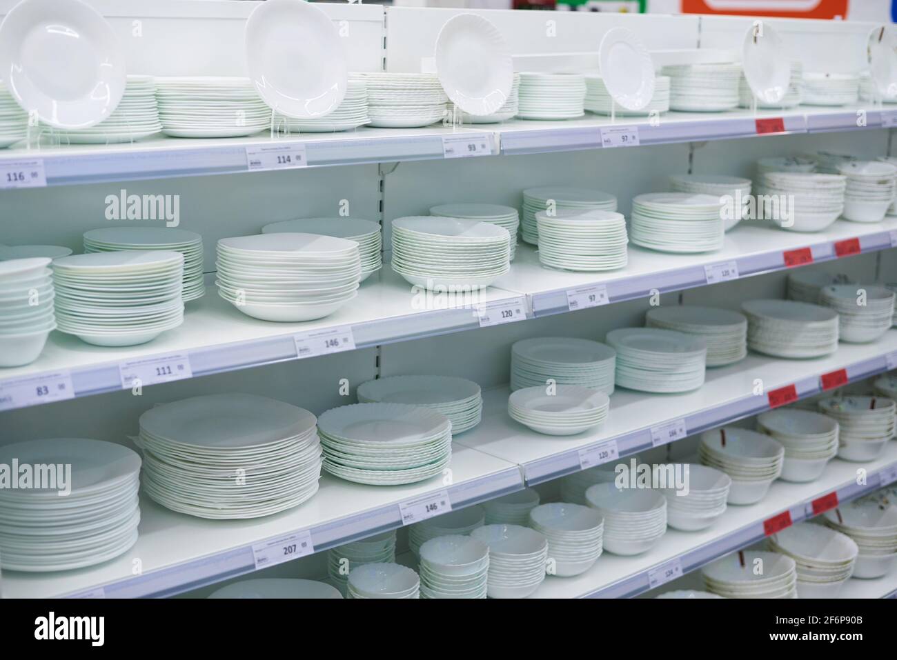 Rows of shelves with crockery in a supermarket Stock Photo - Alamy
