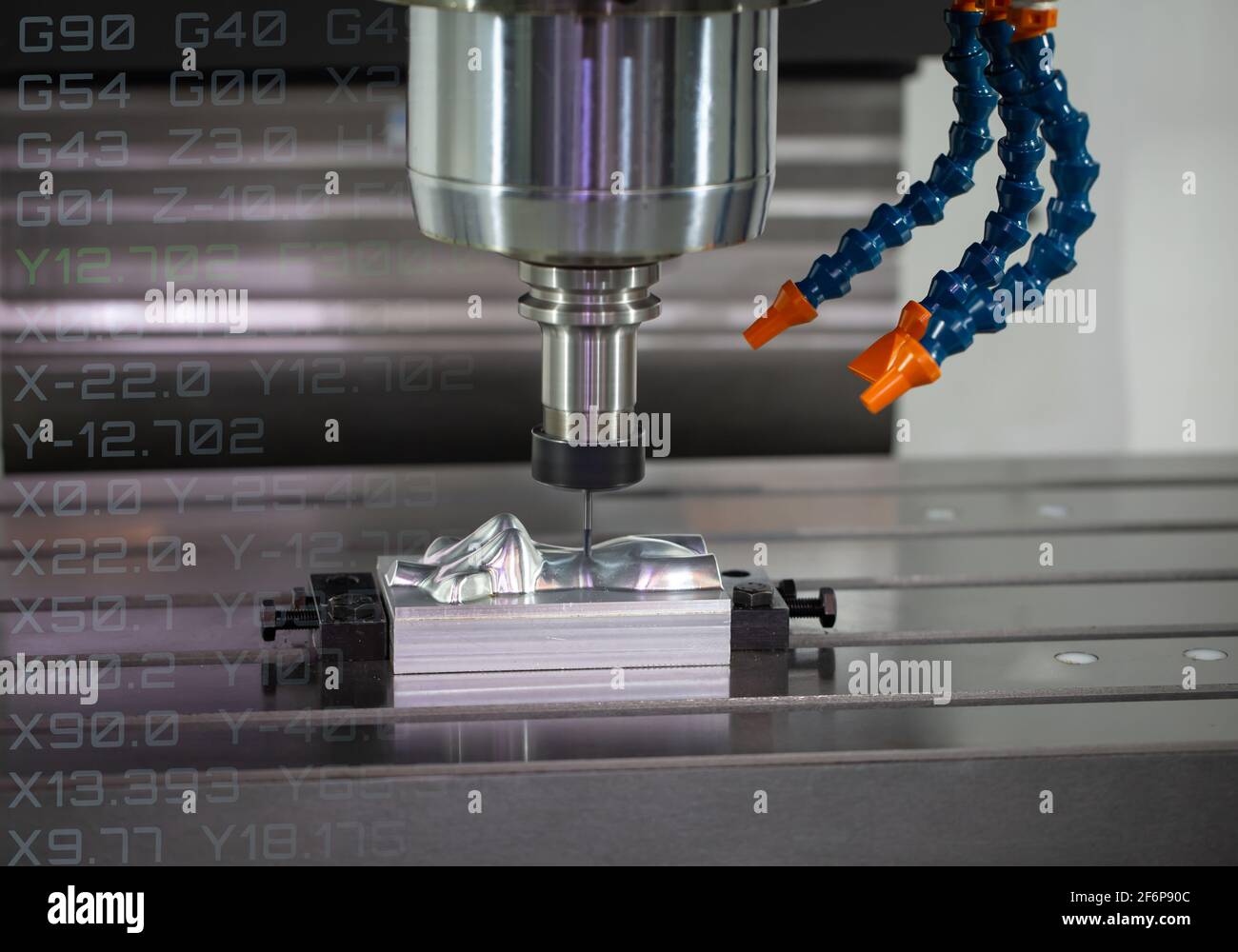 CNC milling machine cutting woman body shape. CNC programming code ...