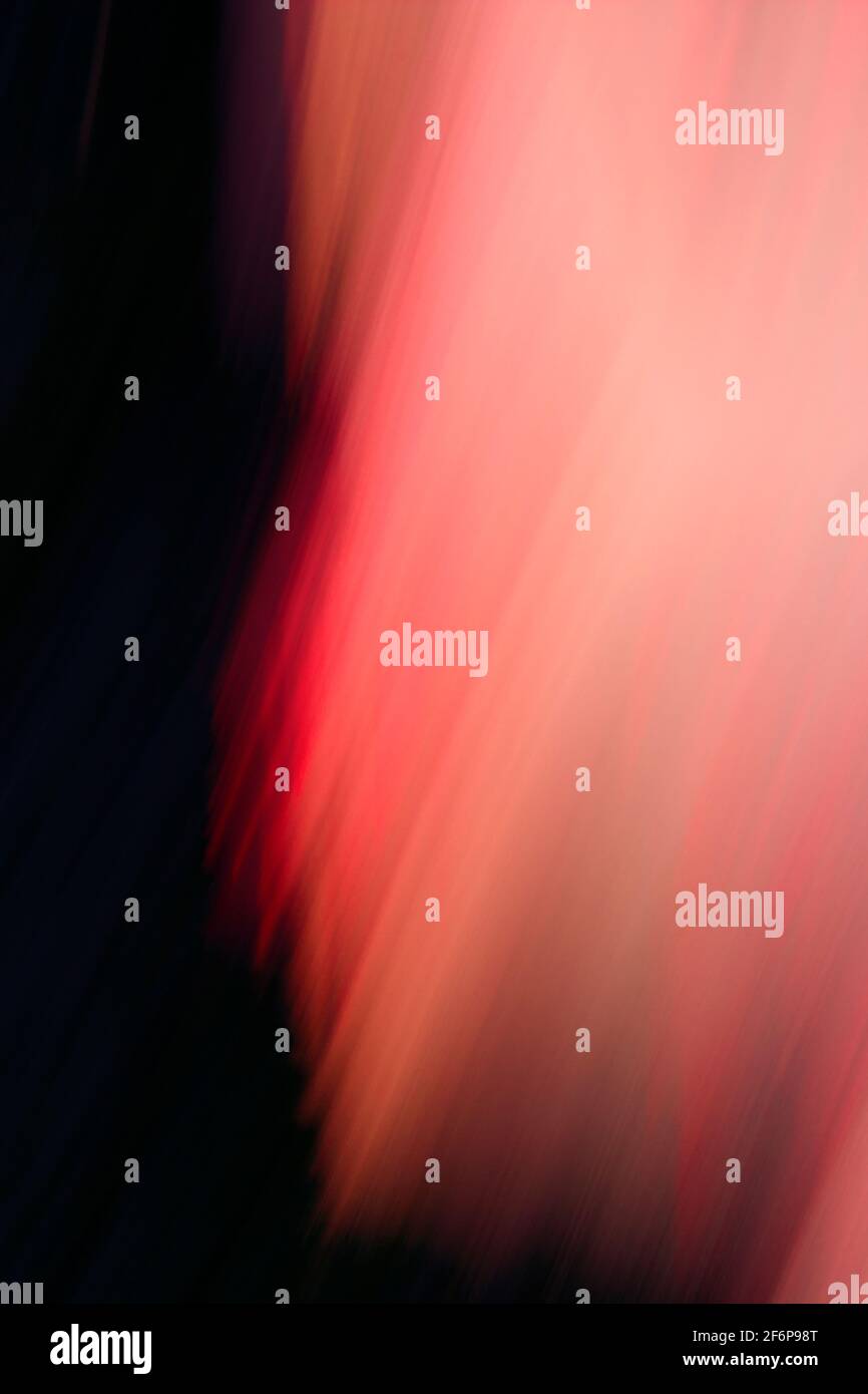 red dynamic color spots on a black background Stock Photo - Alamy