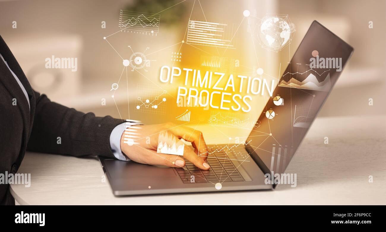 Side view of a business person working on laptop Stock Photo - Alamy