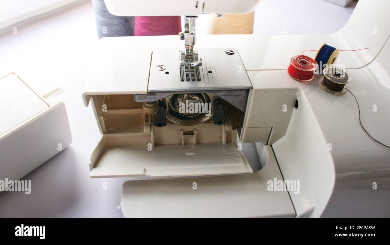 electric sewing machine with thread and bobbin Stock Photo - Alamy
