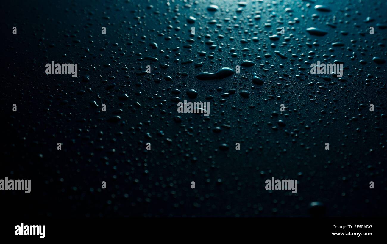 water drops on a plastic blue background in the dark Stock Photo - Alamy