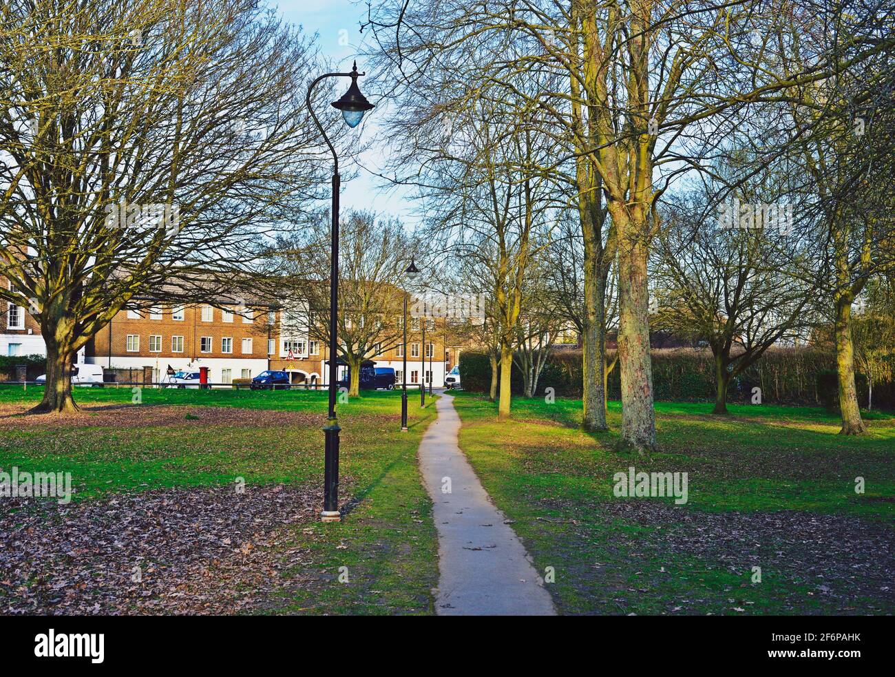 Lamp posts in park with footpath Stock Photo - Alamy