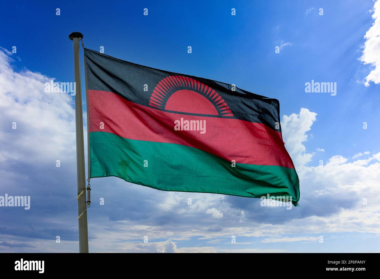 Malawi flag, Republic of Malawi national symbol on a flagpole waving ...