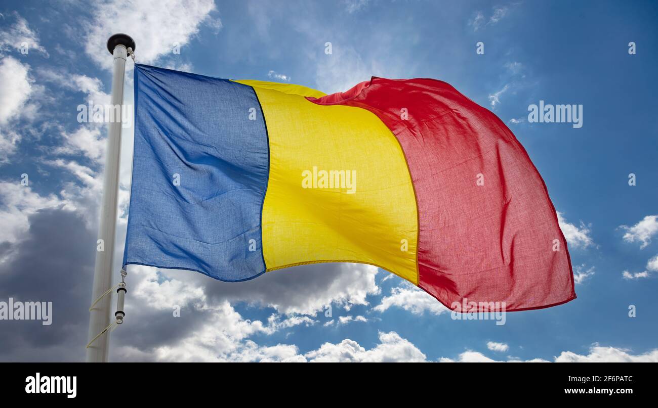 Romania flag, Romanian national symbol on a flagpole waving against ...