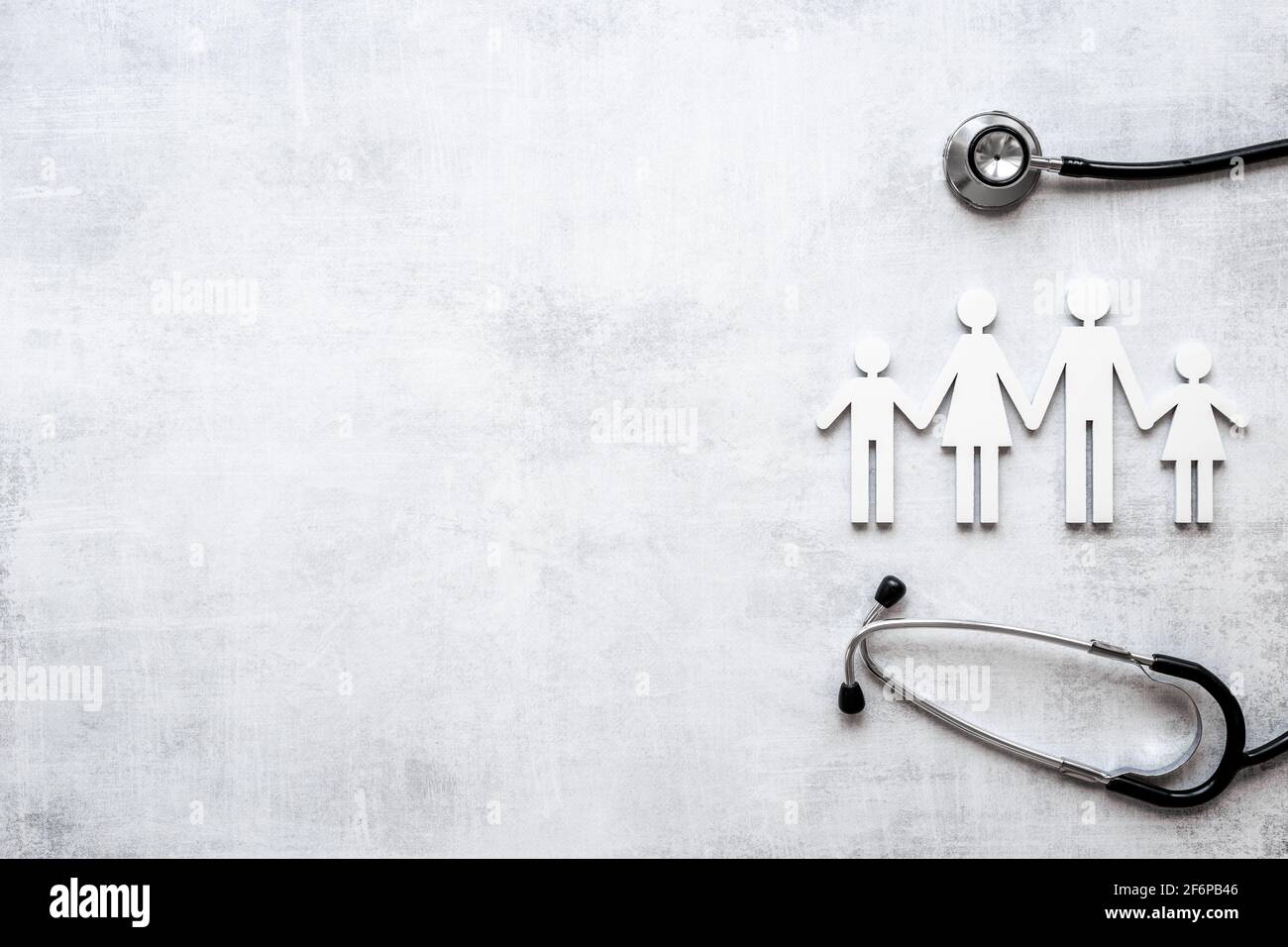 Medical care concept. Family figure with stethoscope, top view Stock ...