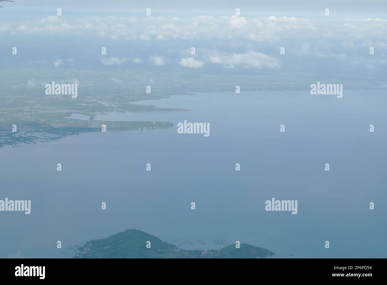landscape of sea and island through from window plane Stock Photo - Alamy