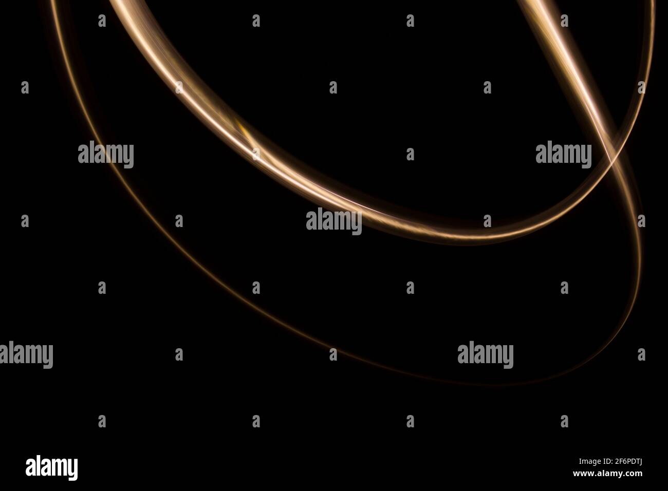 gold light lines on a black background Stock Photo - Alamy