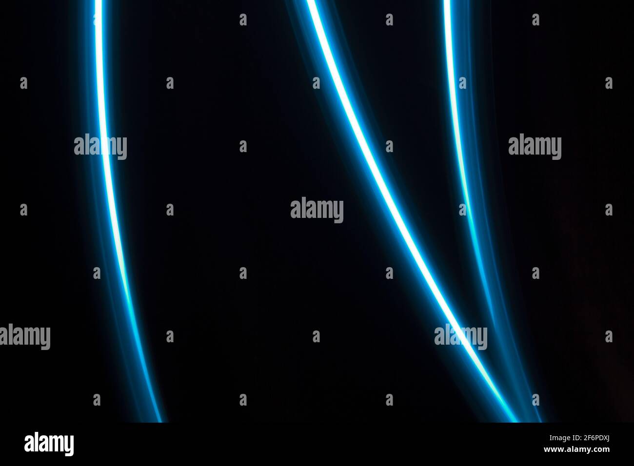 blue light lines on a black background Stock Photo - Alamy