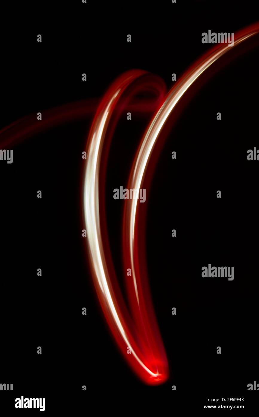 red light lines on a black background Stock Photo - Alamy