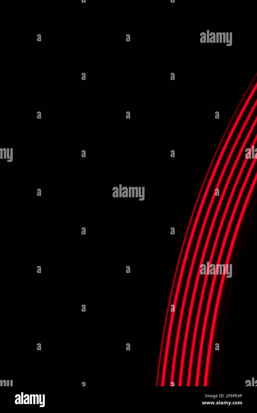 red light lines on a black background Stock Photo - Alamy