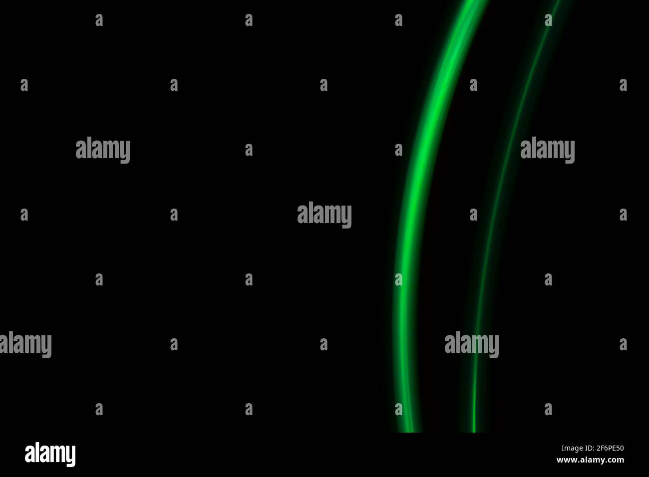 green light lines on a black background Stock Photo - Alamy