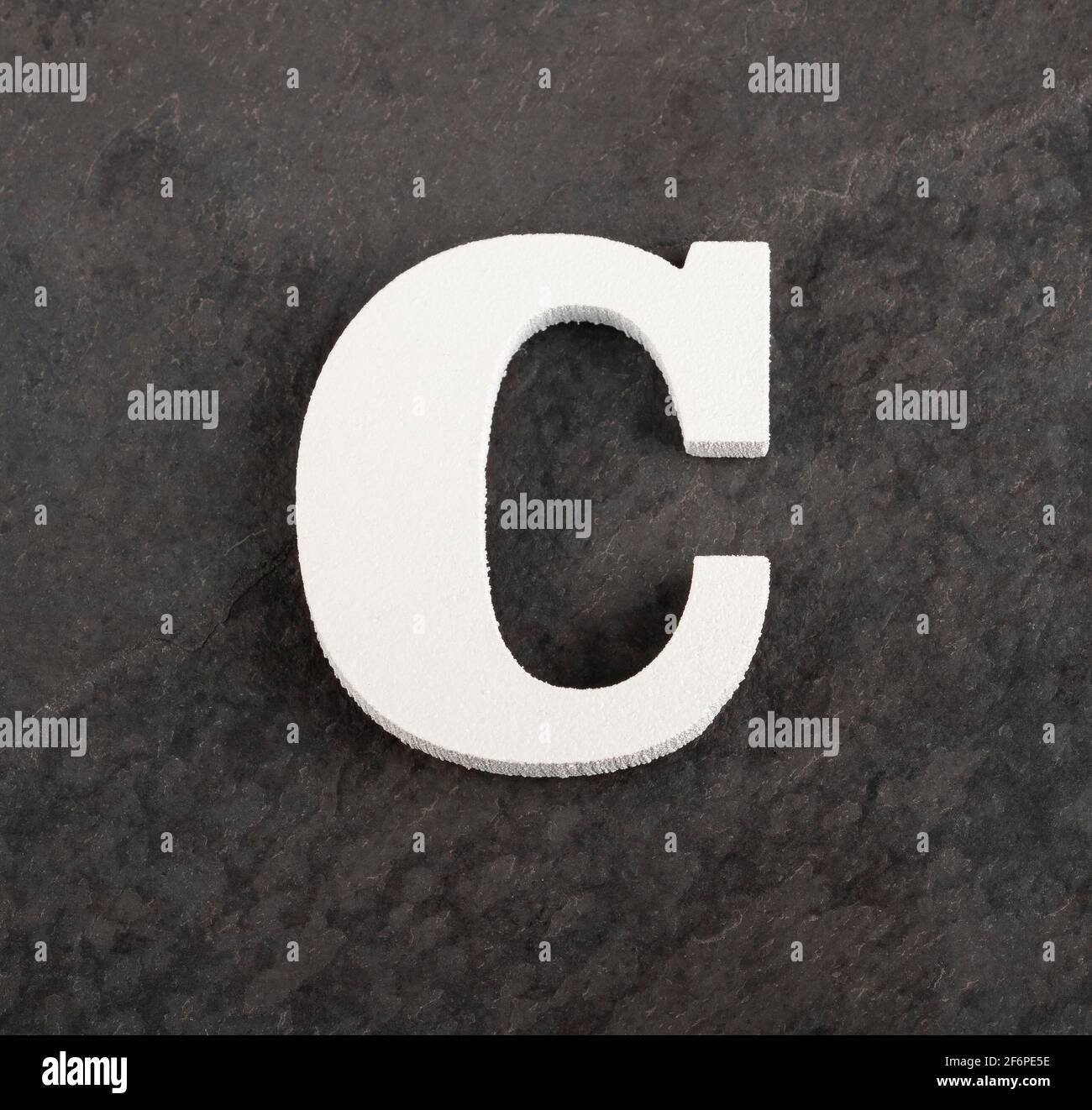 Letter C from blank alphabet on gray background Stock Photo - Alamy