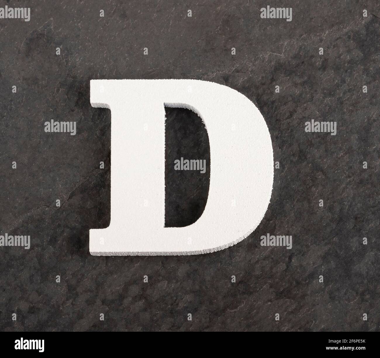 Letter D from blank alphabet on gray background Stock Photo - Alamy