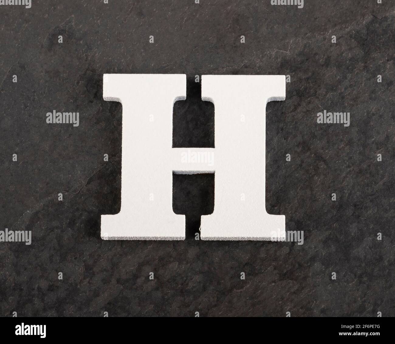 Letter H from blank alphabet on gray background Stock Photo - Alamy