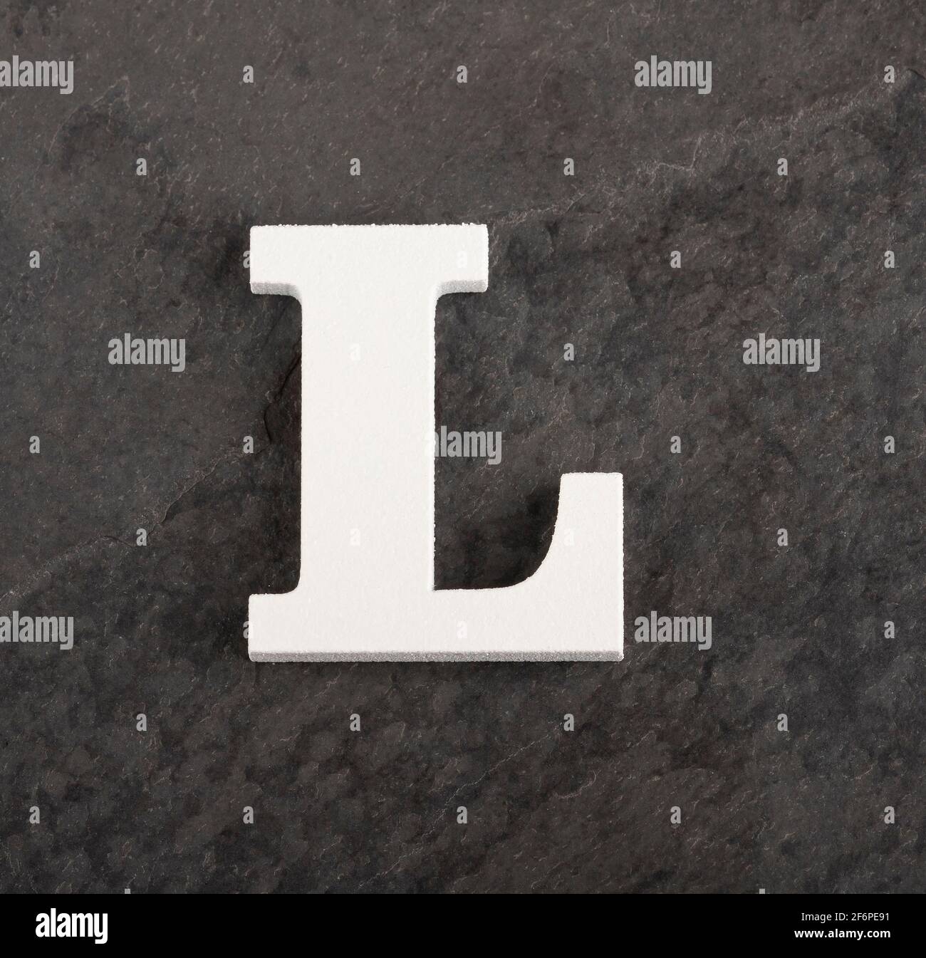 Letter L from blank alphabet on gray background Stock Photo - Alamy