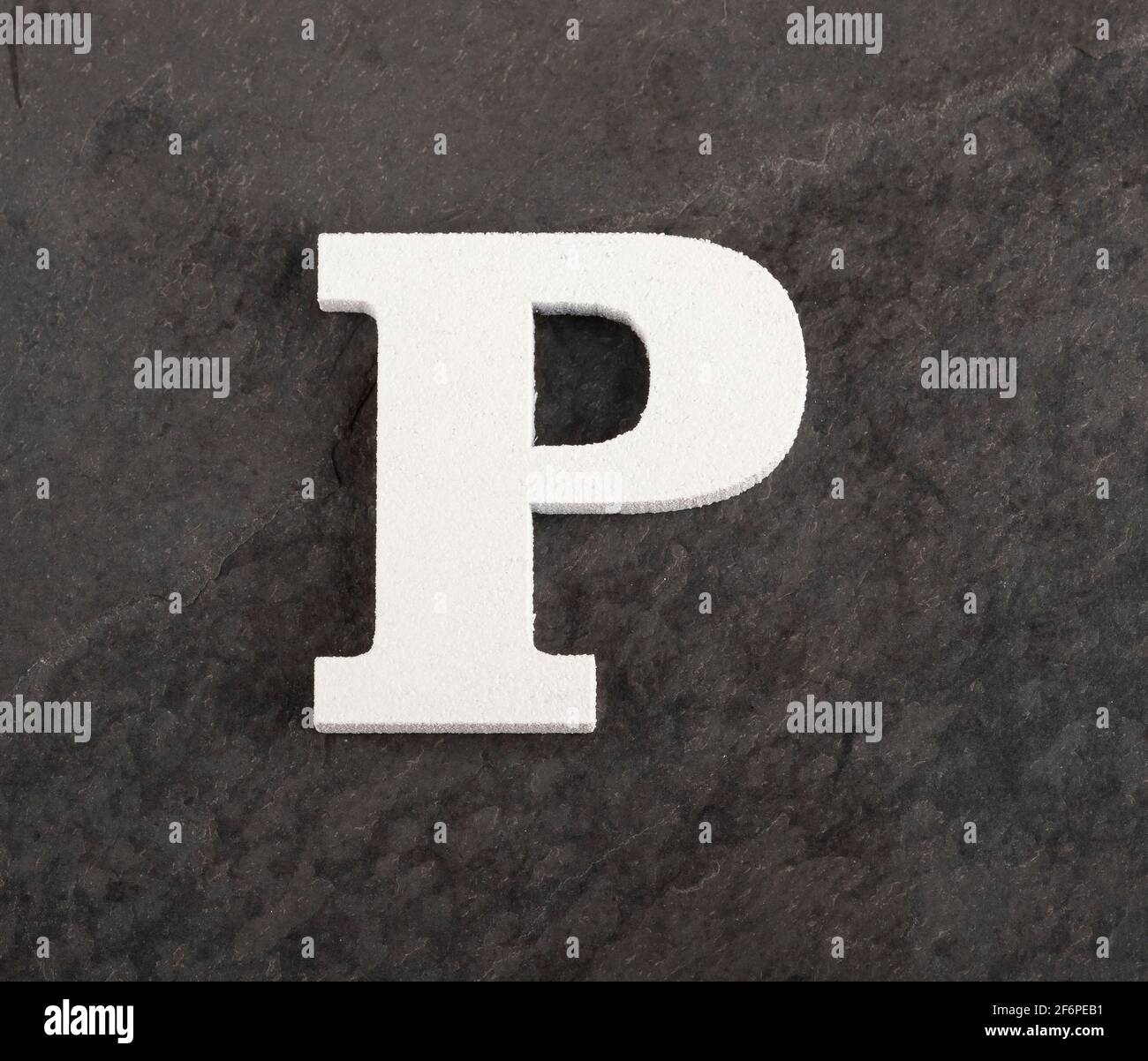 Letter P from blank alphabet on gray background Stock Photo - Alamy