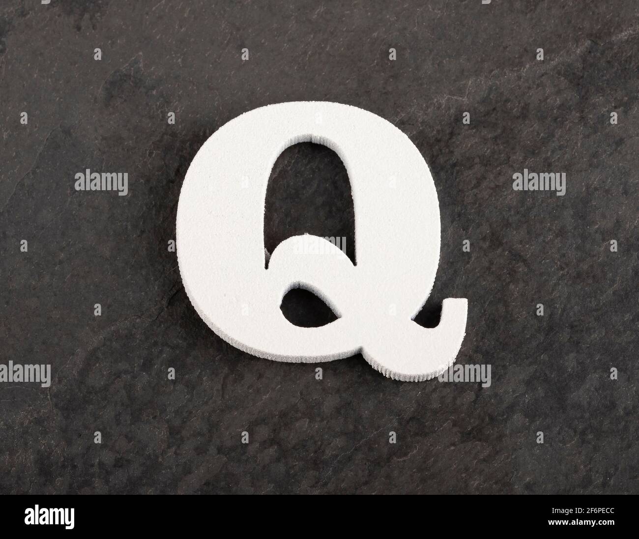 Letter Q from blank alphabet on gray background Stock Photo - Alamy