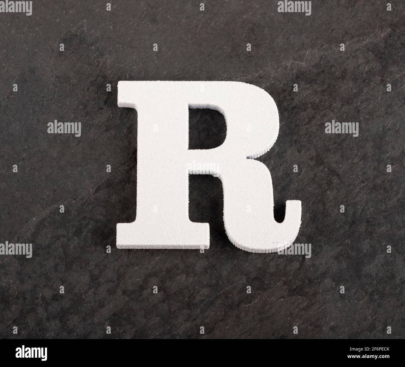 Letter R from blank alphabet on gray background Stock Photo - Alamy