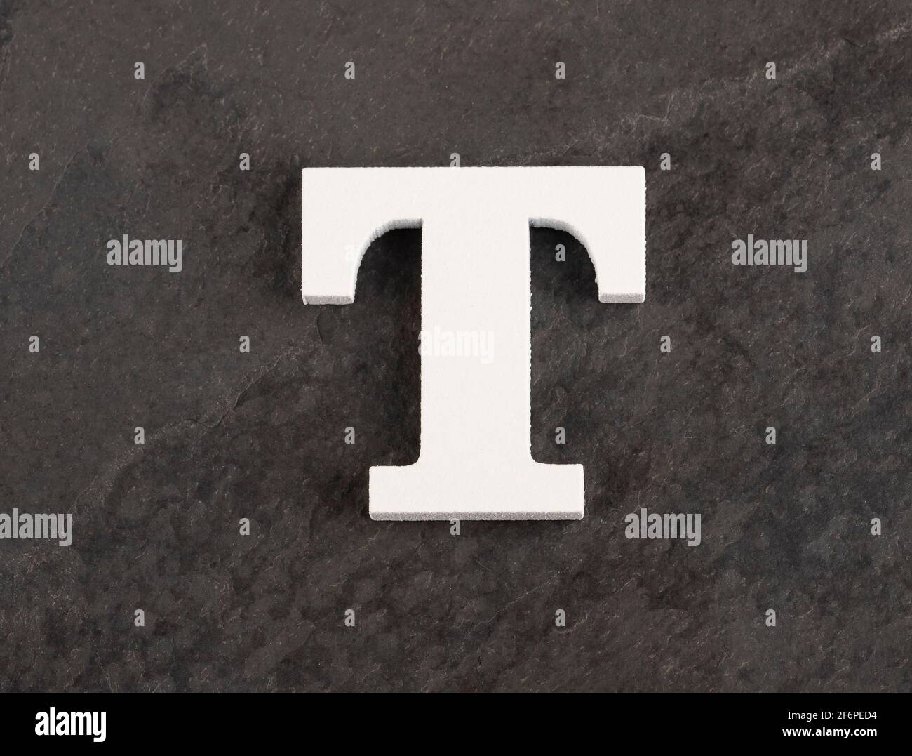 Letter T from blank alphabet on gray background Stock Photo - Alamy