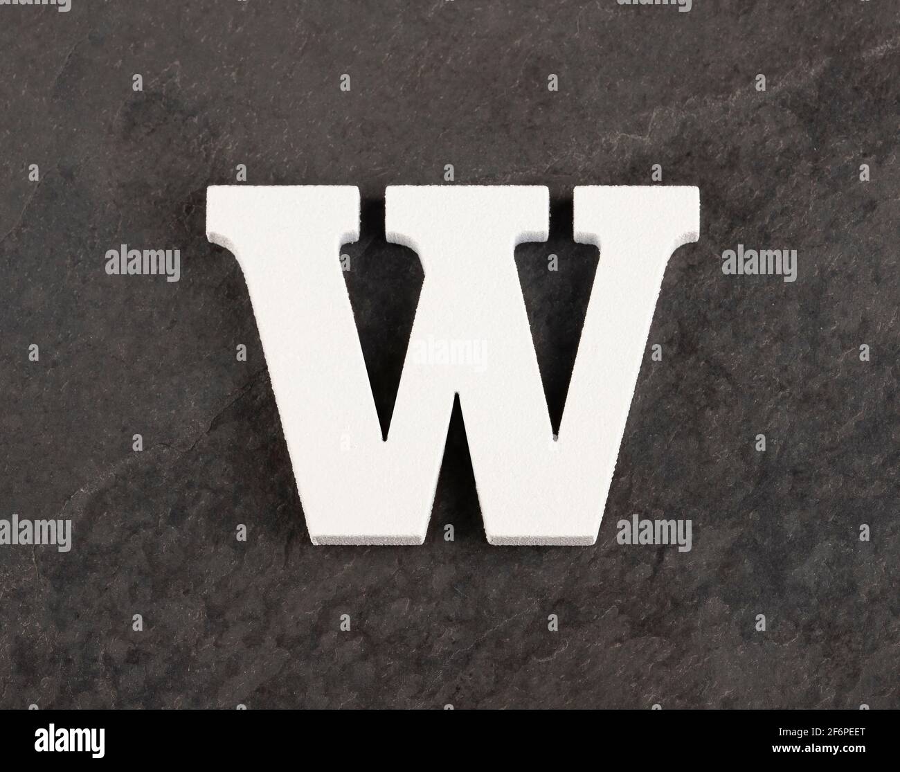 Letter W from blank alphabet on gray background Stock Photo - Alamy