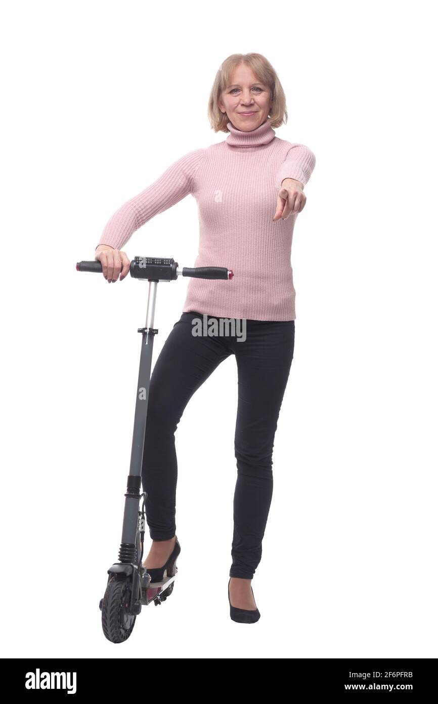 Full length portrait of a woman riding a scooter Stock Photo - Alamy