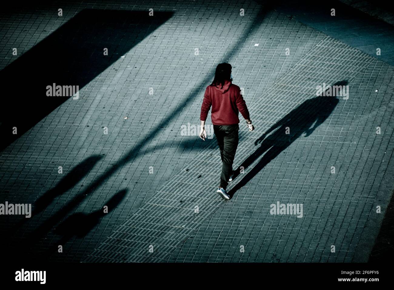 young, man, walking, shadow, night,street, pavement, dark, city, rear ...