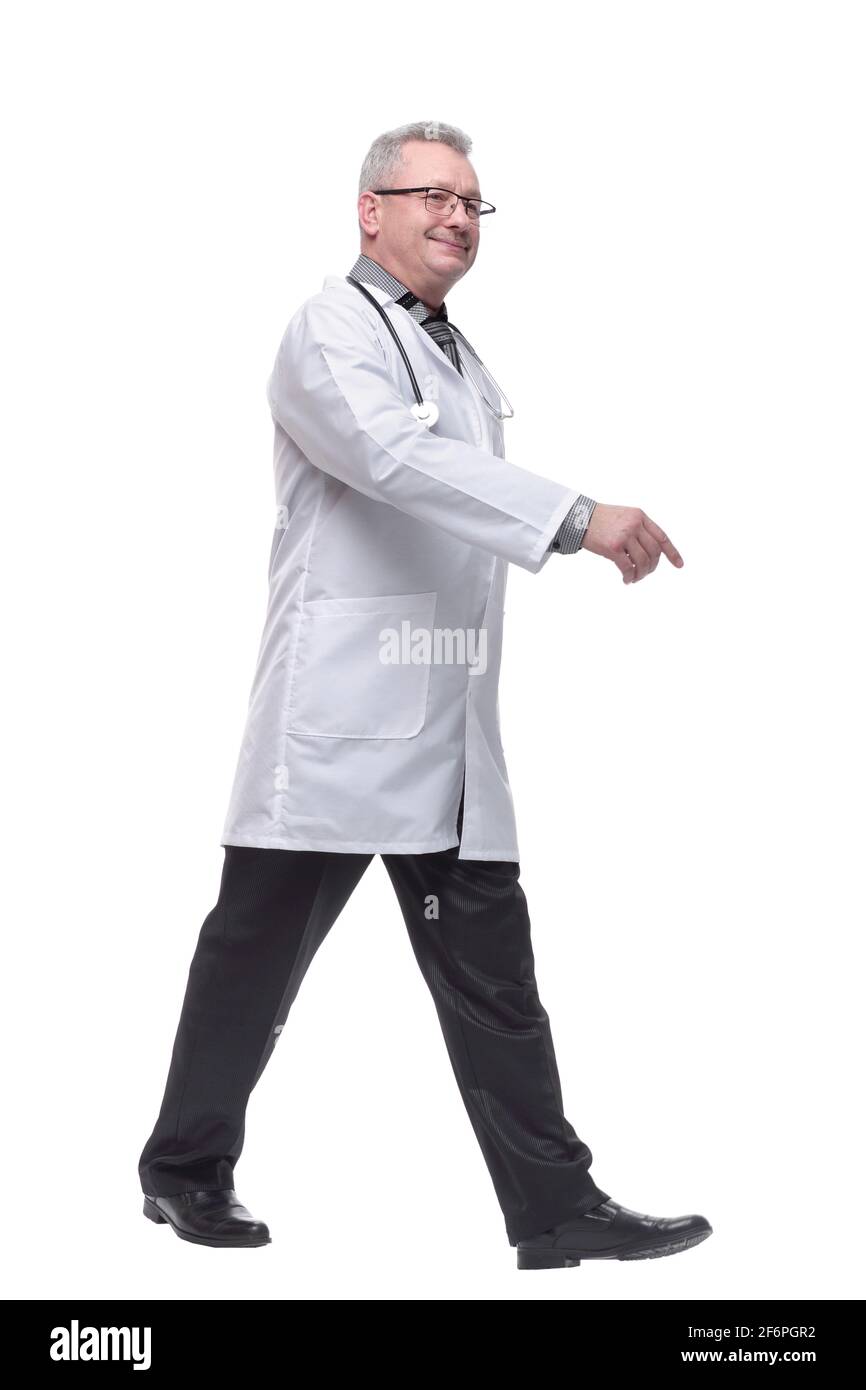 Walking mature doctor, side view. Full length studio shot Stock Photo ...