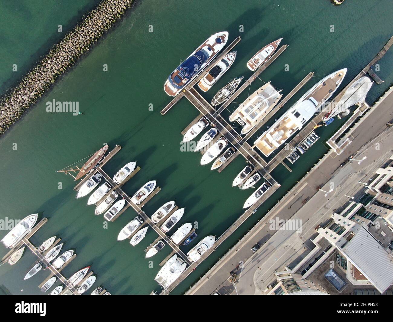 aerial view of small marina with superyachts and smaller leisure ...