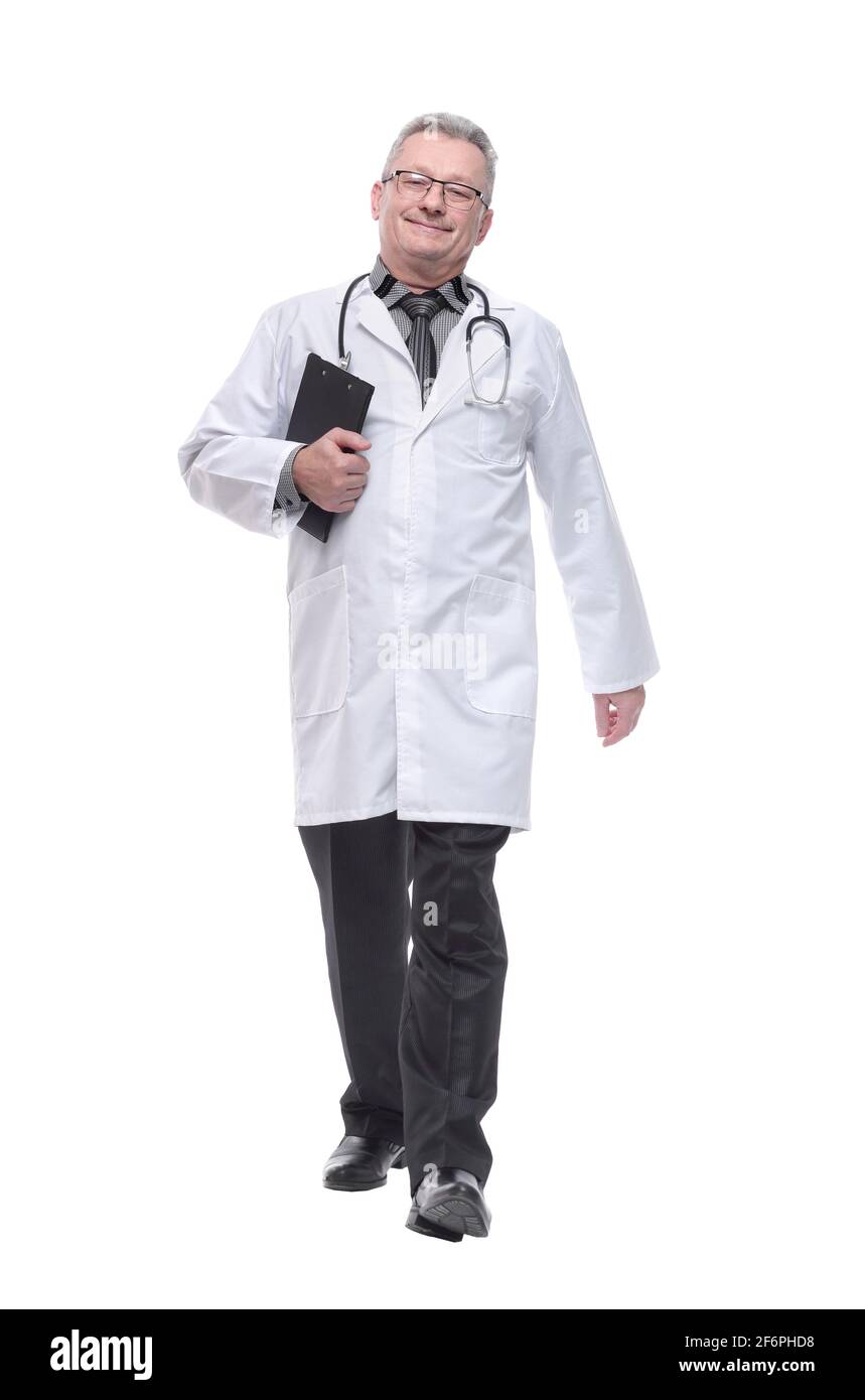 Full length portrait of a smiling male doctor walking towards the ...
